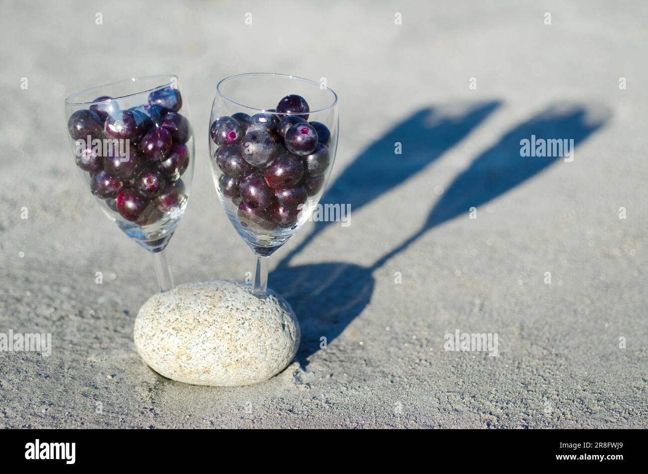 Wine Glasses with Grapes and Shadow Stock Photo - Alamy