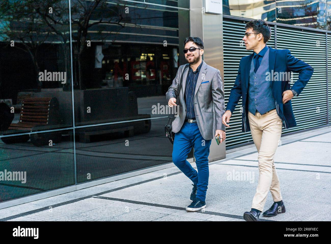 Walking two colleagues talking hi-res stock photography and images - Alamy