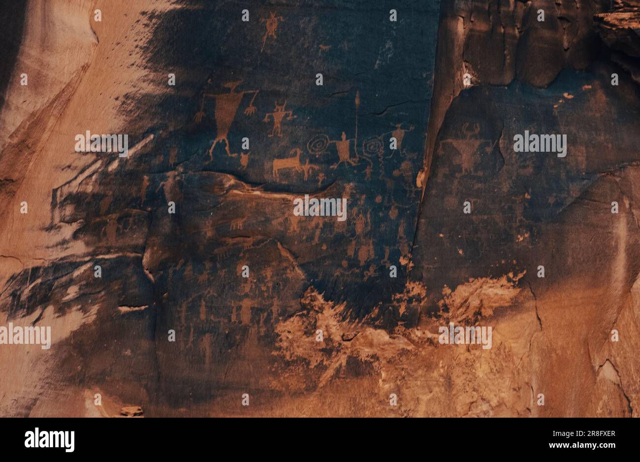 The ancient petroglyphs carved into the rock face of a canyon in Potash ...