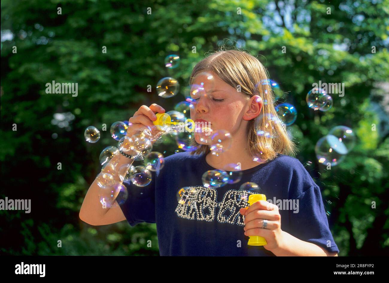 Girl making soap bubbles hi-res stock photography and images - Alamy