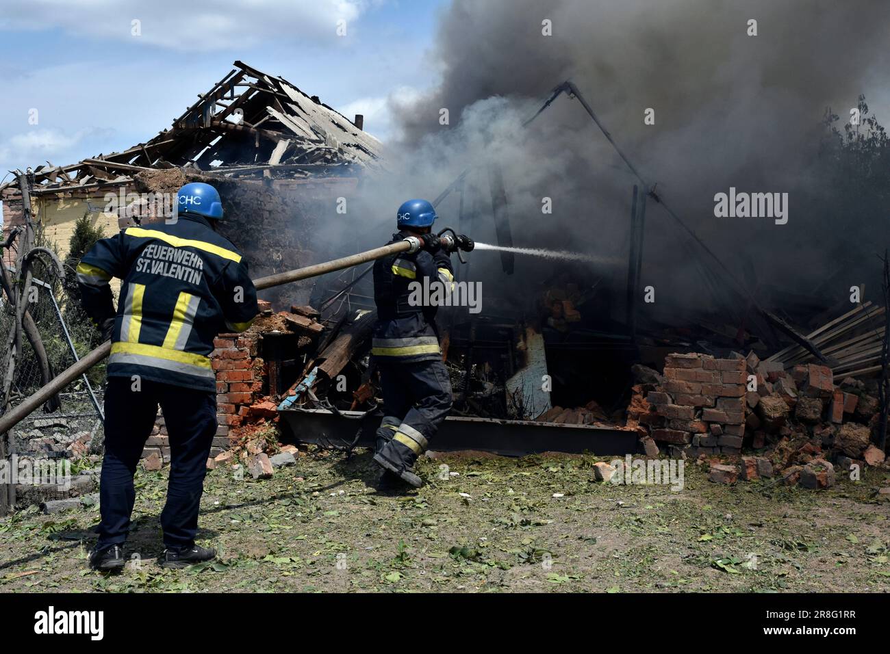Ukrainian State Emergency Service firefighters put out fire after a ...