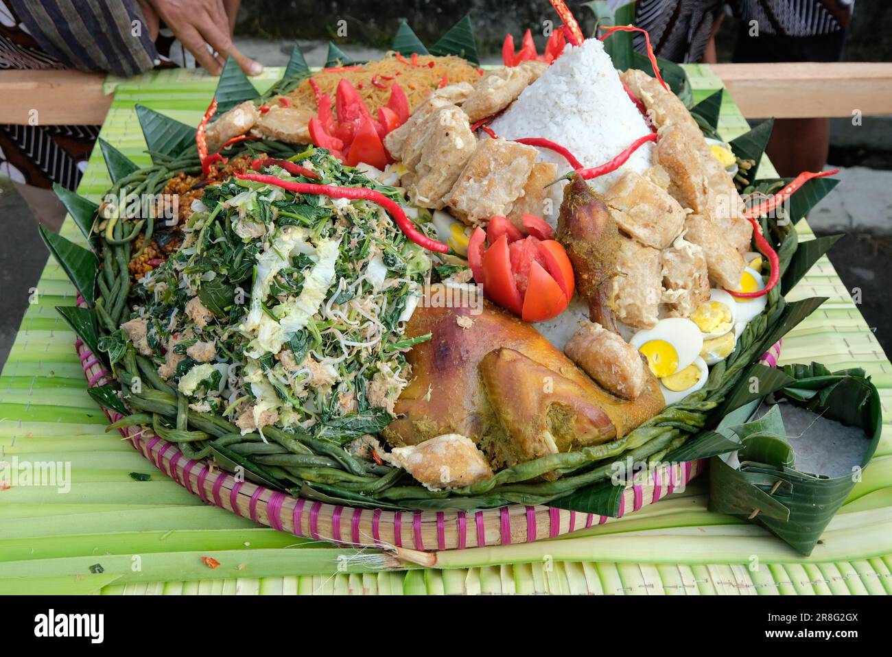 Nasi tumpeng (cone rice) served with urap-urap (Indonesian salad ...
