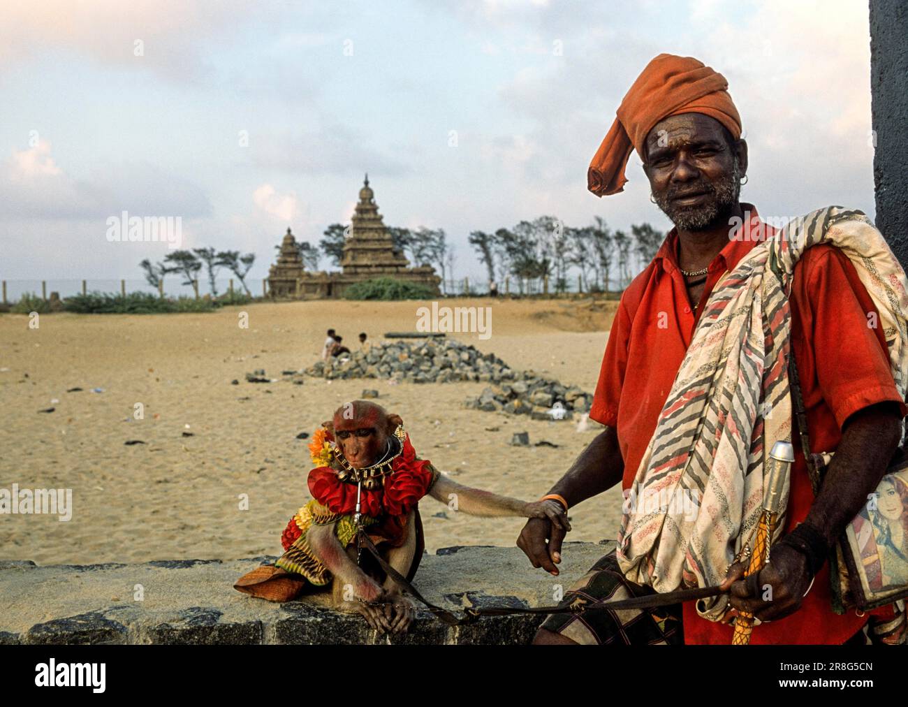 Monkey charmer behind shore temple in Mahabalipuram Mamallapuram near ...