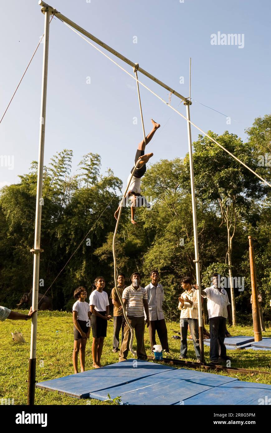 A girl performing Indian Pole Gymnastics, Mallakhamba mallakhamb is an ...