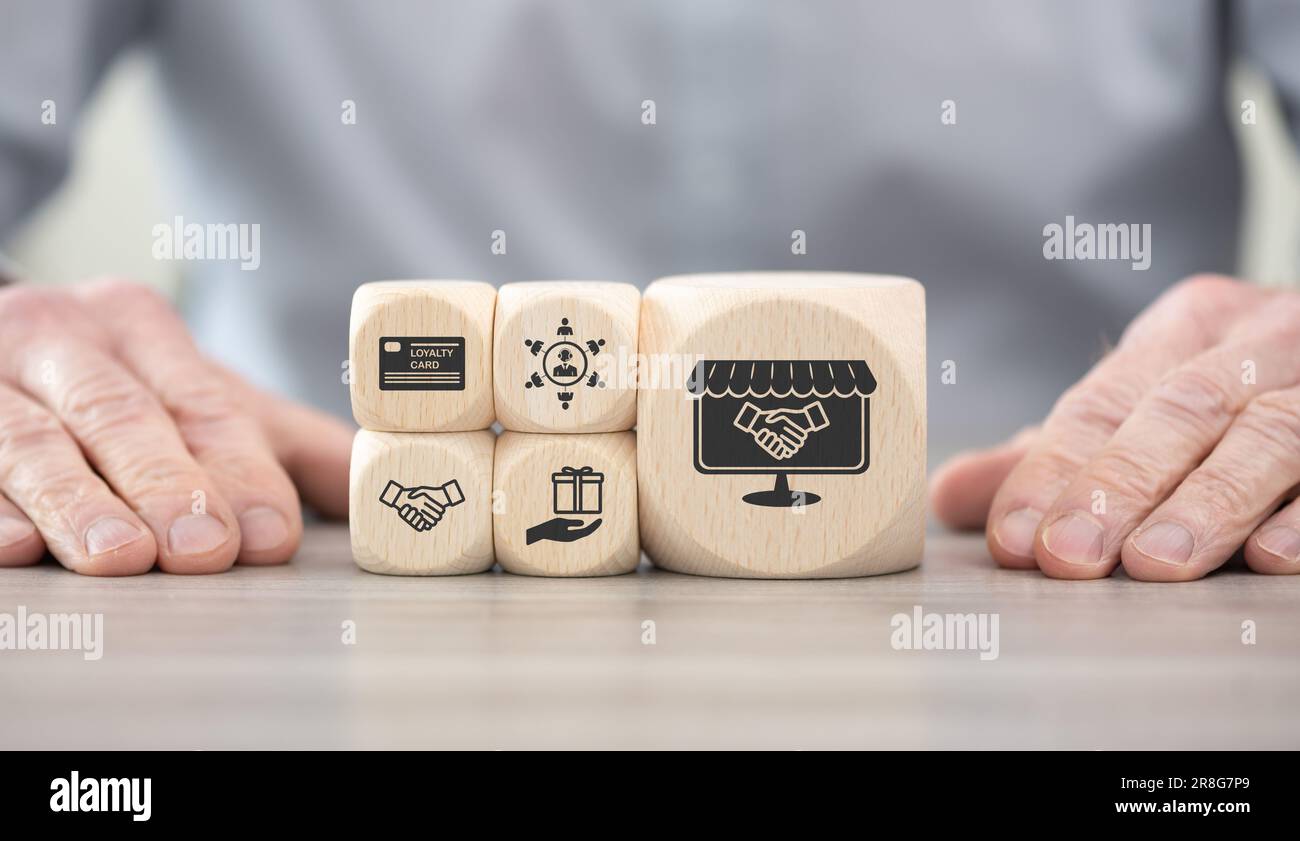 Wooden blocks with symbol of customer loyalty concept Stock Photo - Alamy