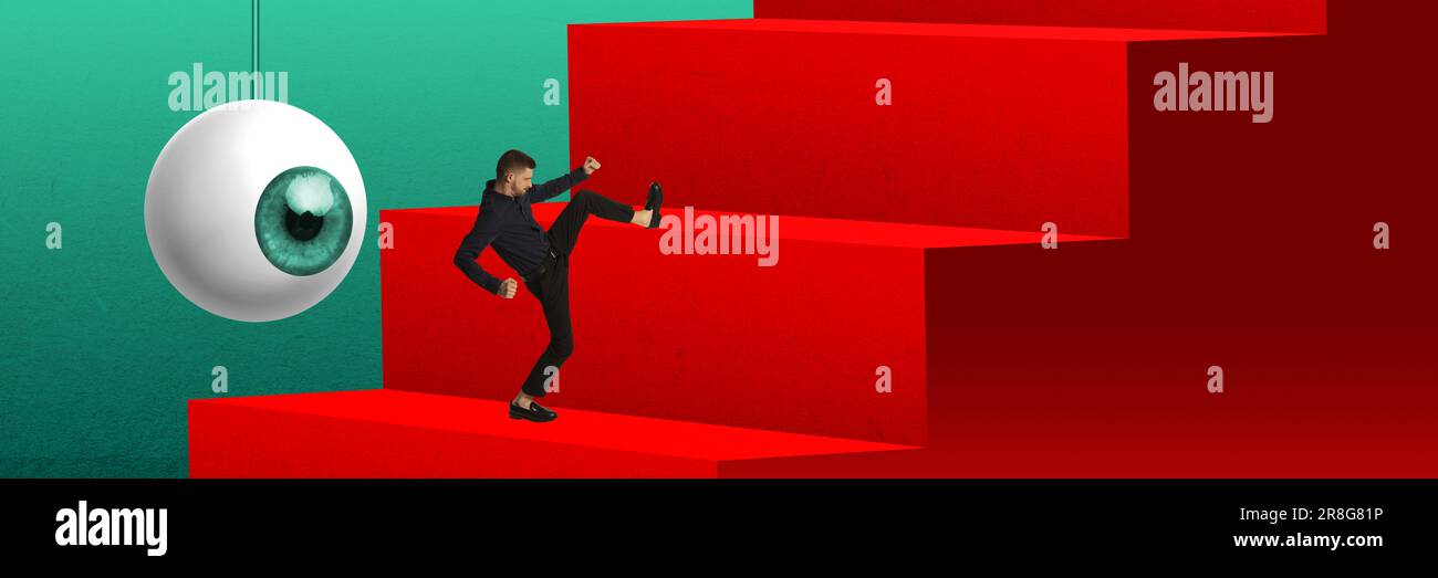 Motivated employee, young man stepping on giant stairs upwards to ...