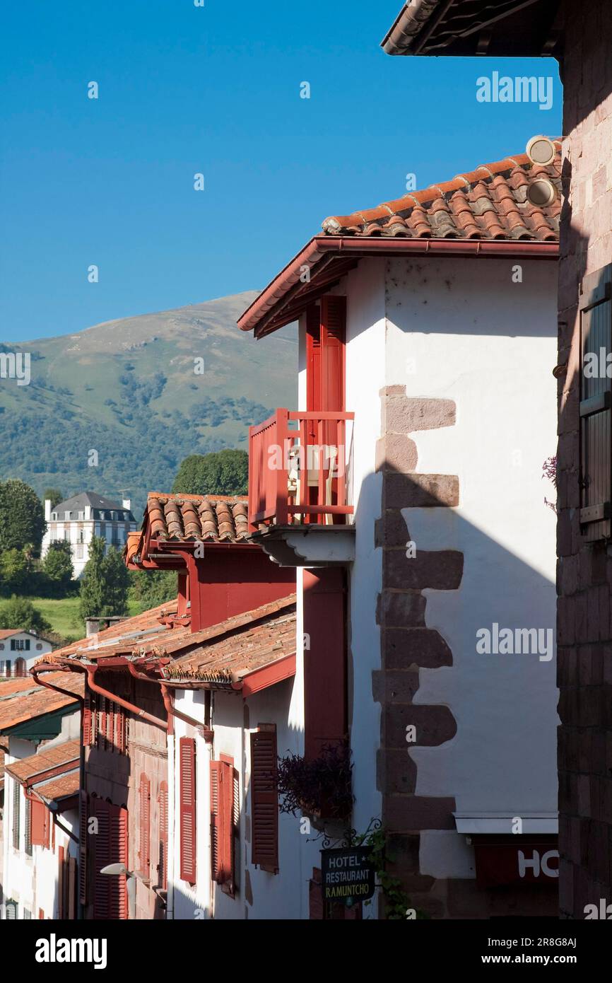 Street view in St. -Jean-Pied-de-Port, with a view of the Pyrenees ...
