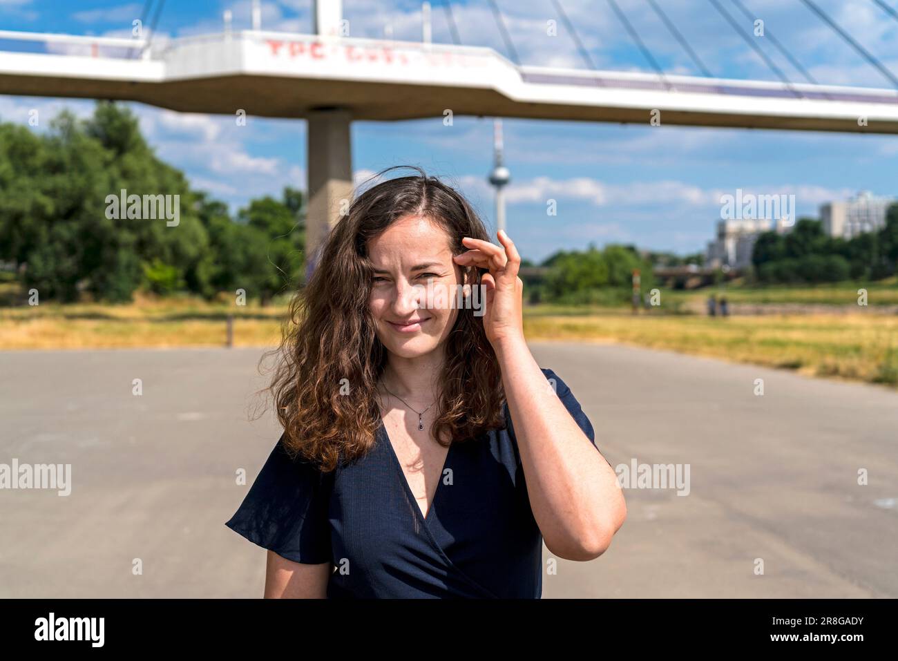 Young woman with open hair in urban setting Stock Photo - Alamy