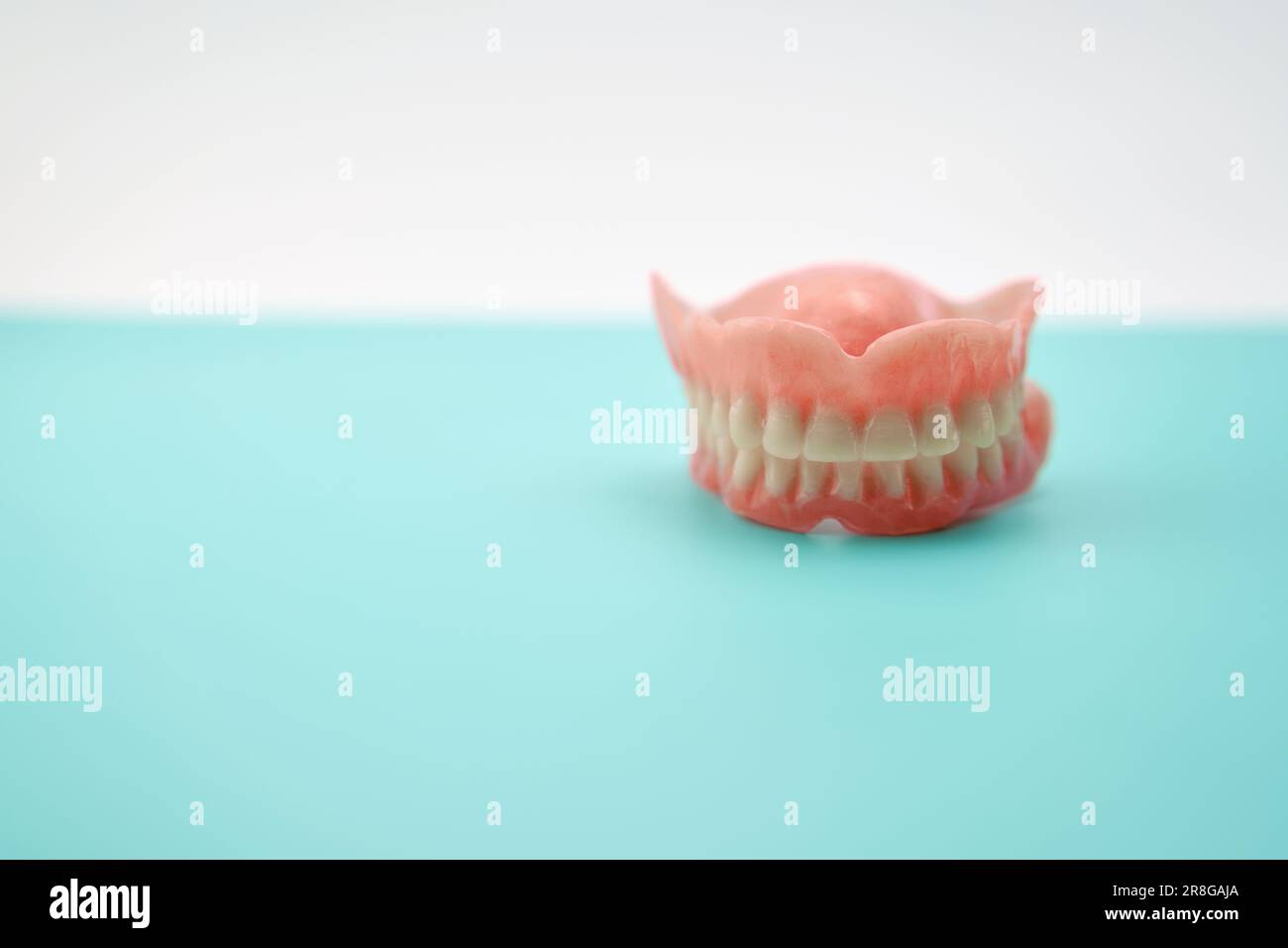 Dentures on top of a green work table in a denture clinic Stock Photo ...