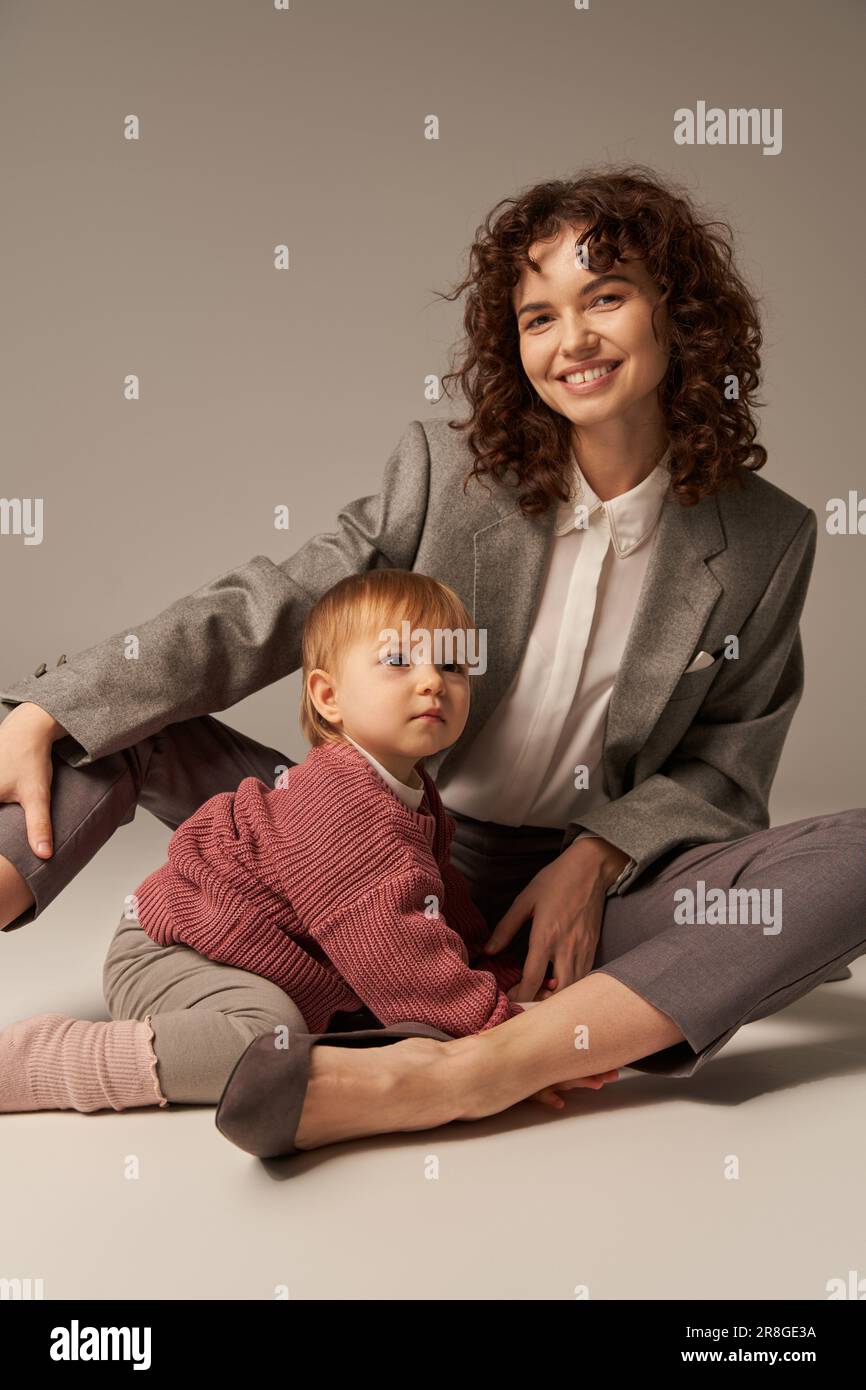 career and family, balanced lifestyle, cheerful mother with curly hair ...