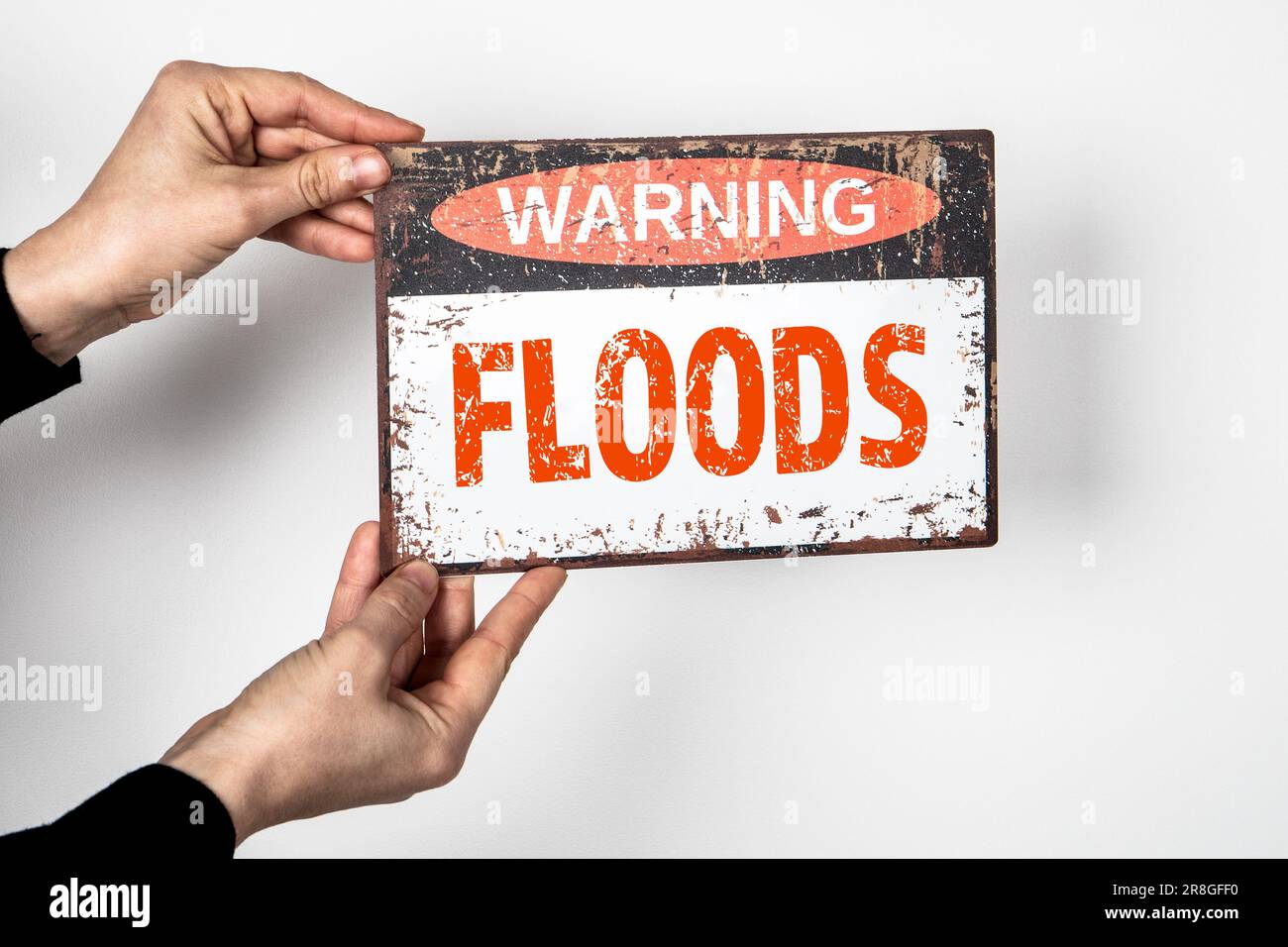 FLOODS. Warning sign with text on a white background Stock Photo - Alamy