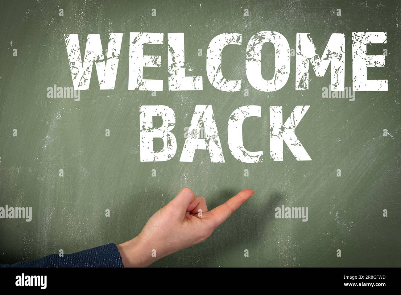 Welcome back. Text on a green chalk board Stock Photo - Alamy