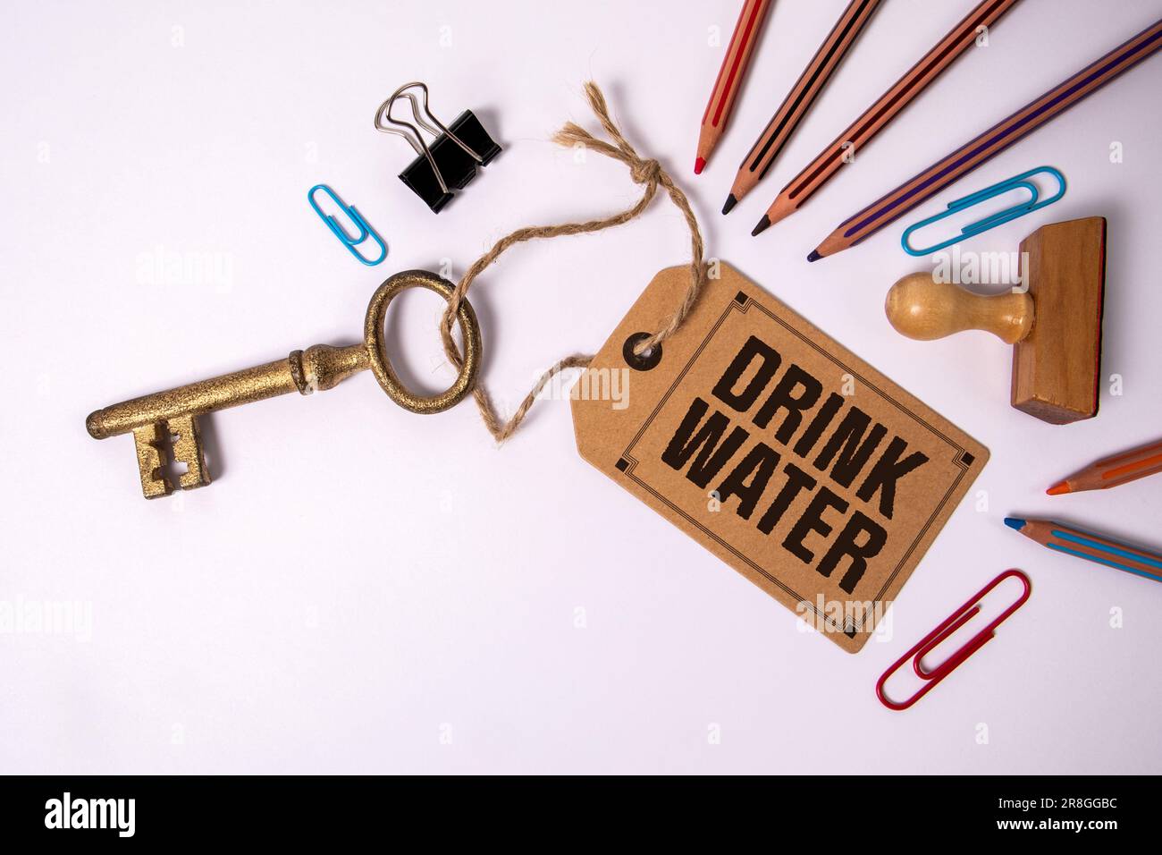 Drink Water. Cardboard price tag with text on white office table Stock ...