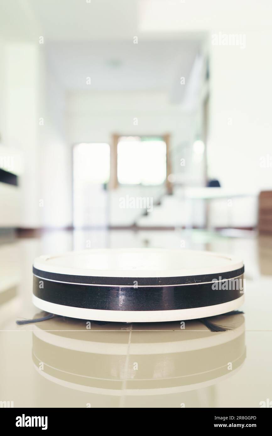 home vacuum cleaning robot cleaning the room Stock Photo - Alamy