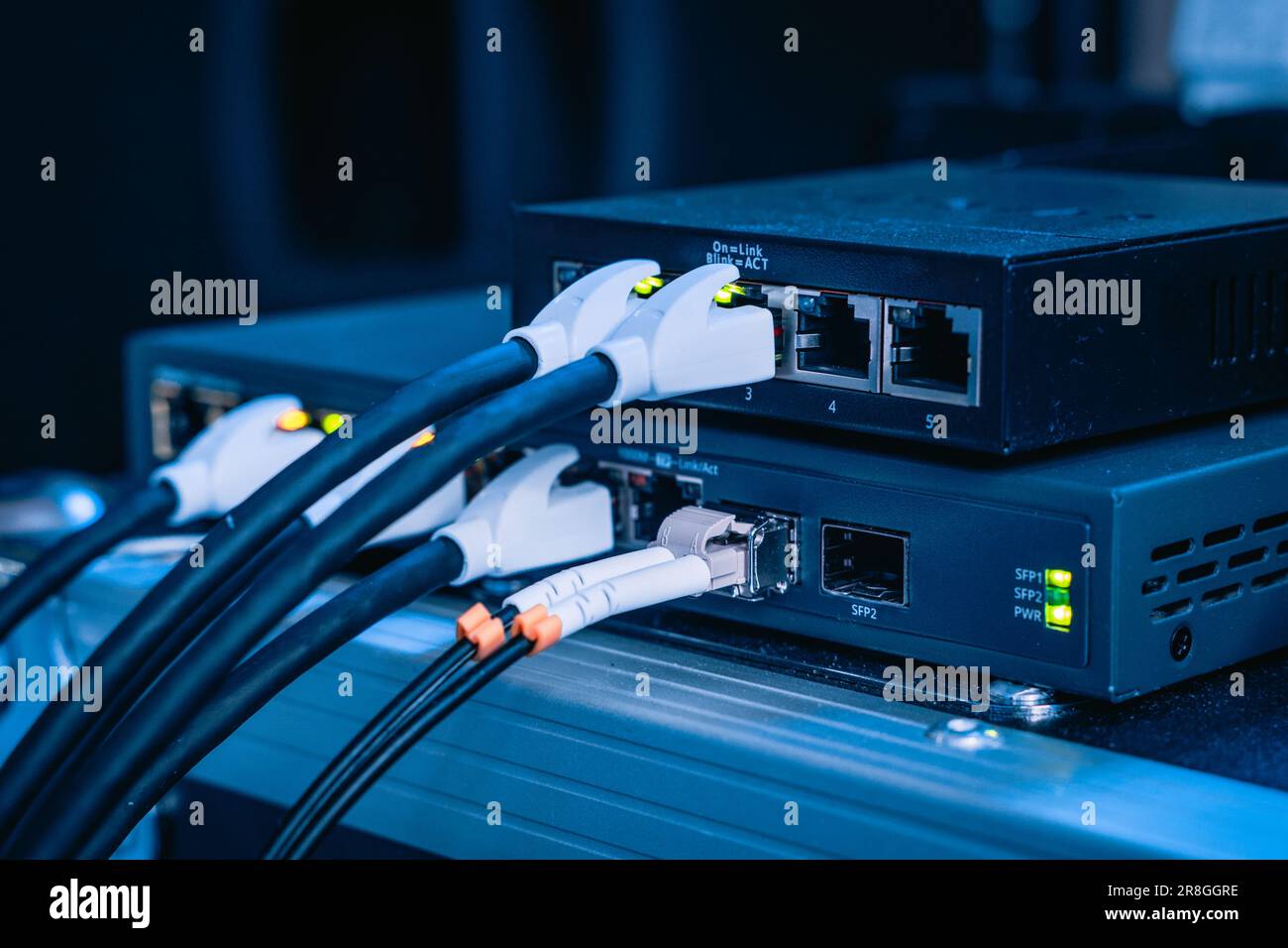 Several ethernet cables linked to a network router for establishing an internet connection Stock ...