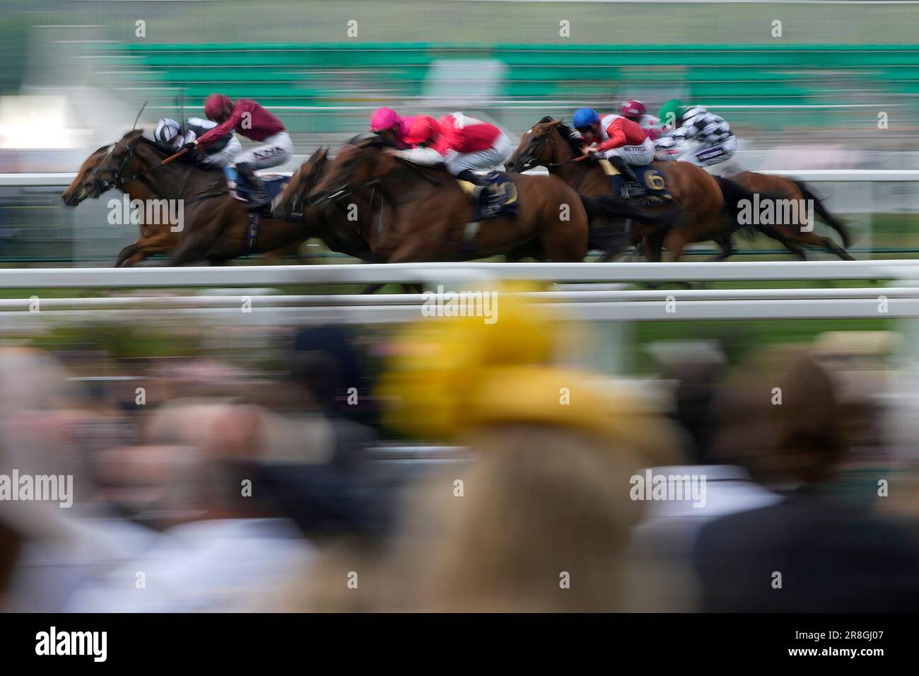 Jockeys race with their horses on day two of the Royal Ascot horse ...