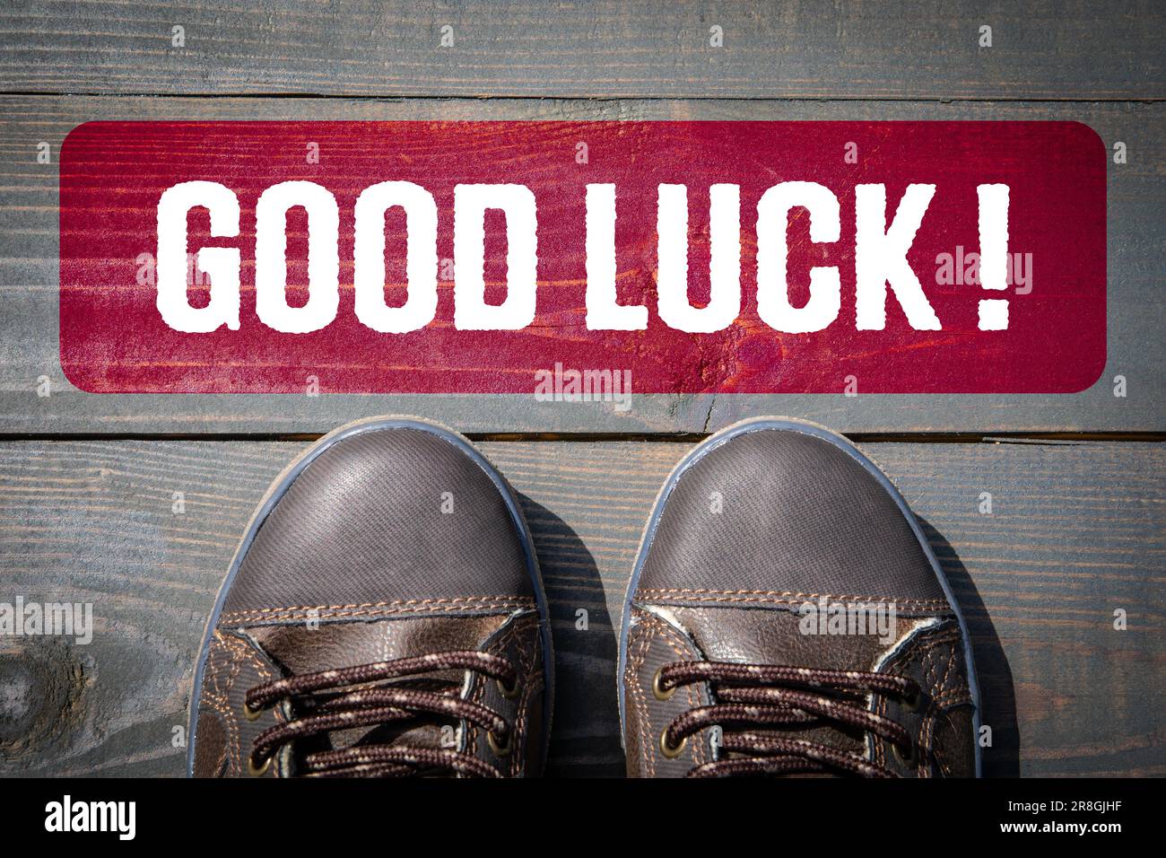 Good Luck. Motivation and inspiration concept. Street shoes on a wooden ...