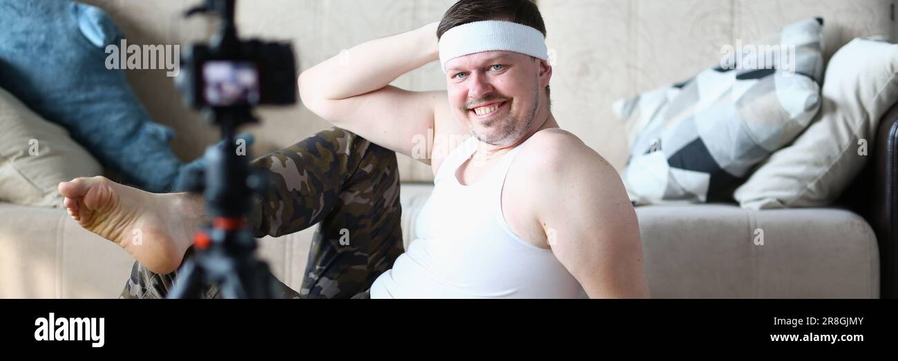 Athletic man recording workout hi-res stock photography and images - Alamy