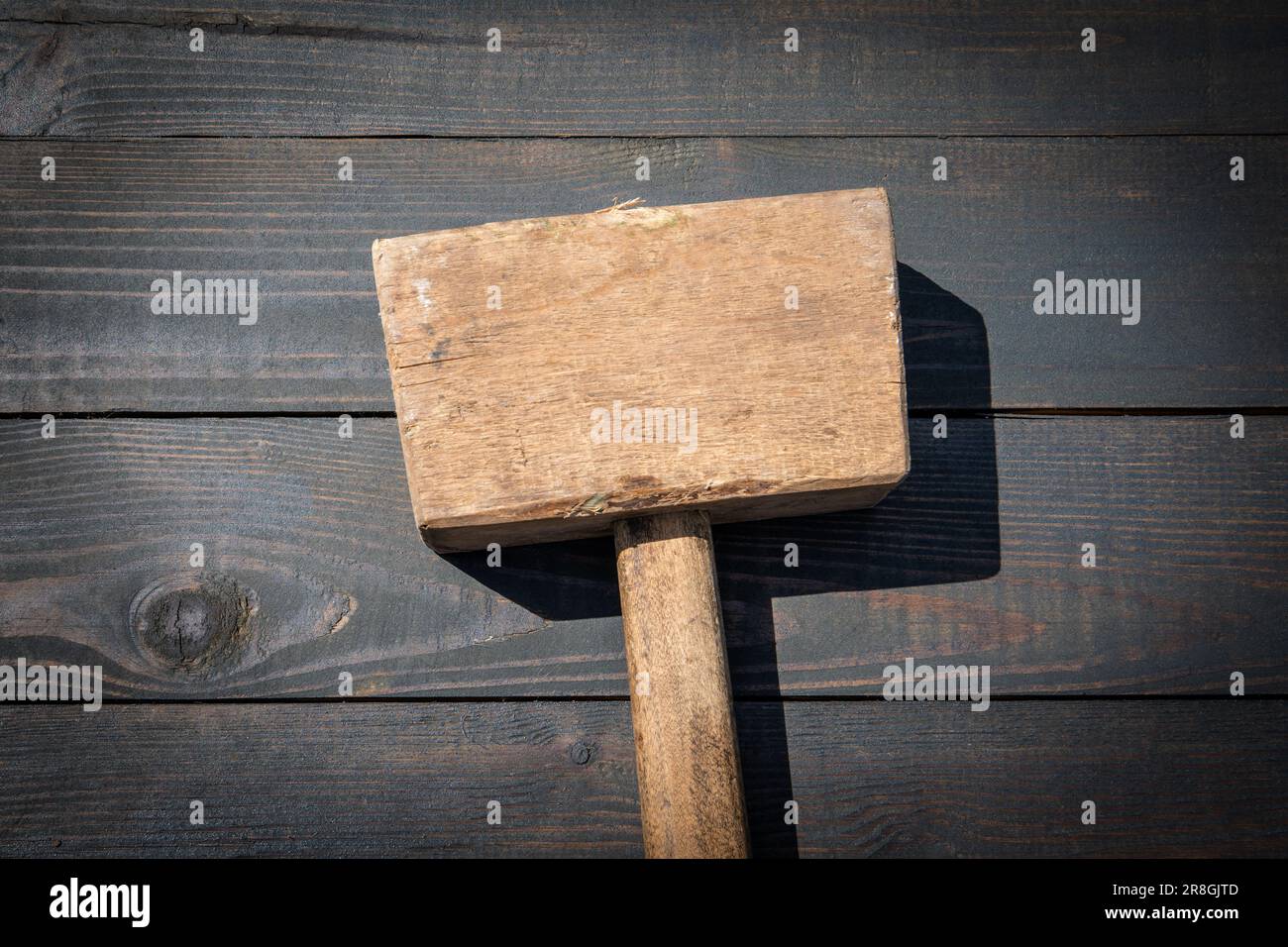 Old wooden carpenter's hammer on dark wood texture background Stock ...