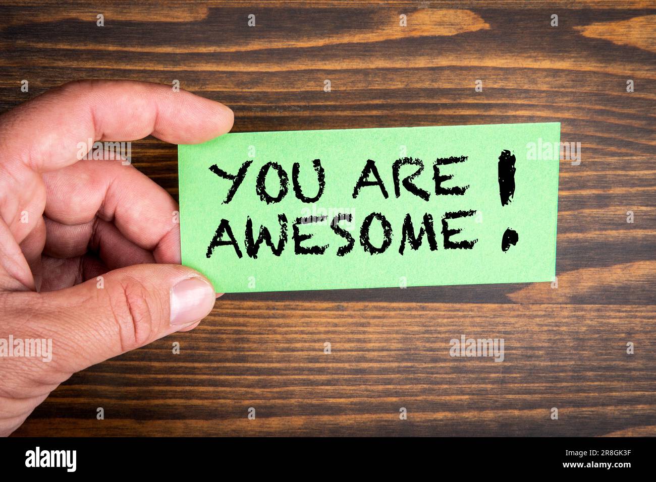 You are awesome. Inspiration and motivation concept. Green sheet with ...