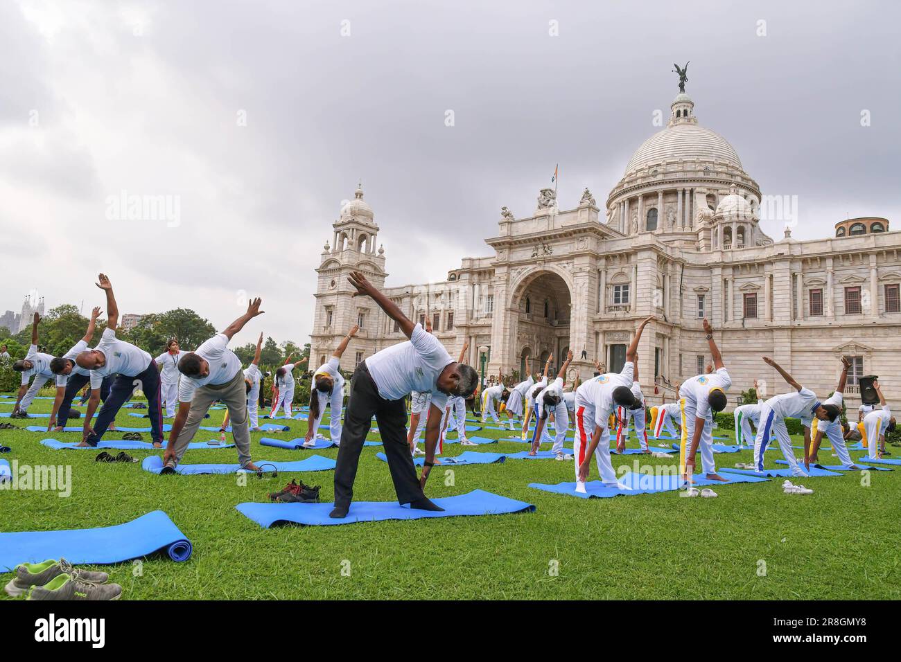 People take part during the Yoga day at Victoria memorial hall ...
