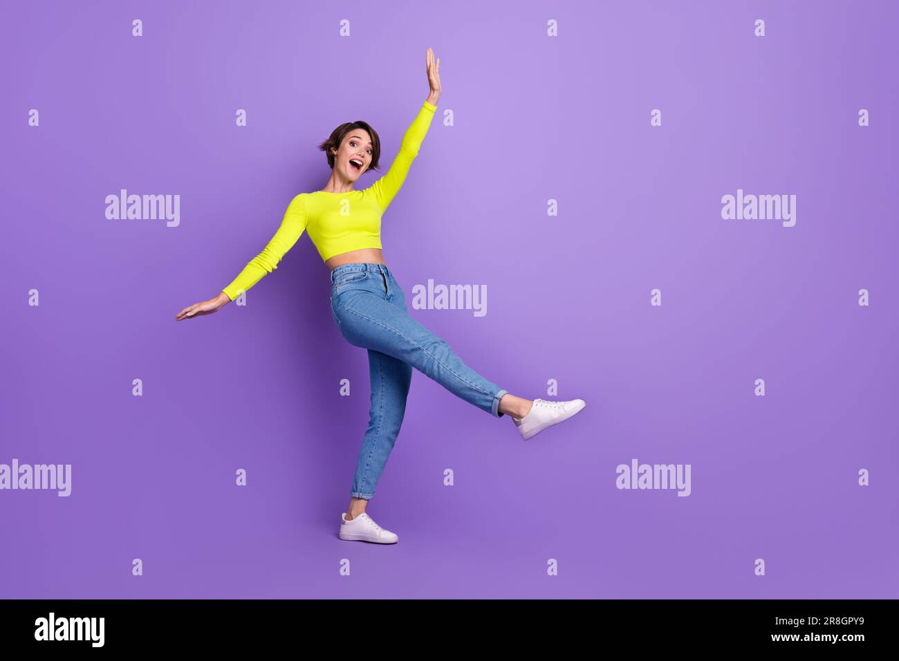Full size portrait of carefree overjoyed girl have good mood dancing ...