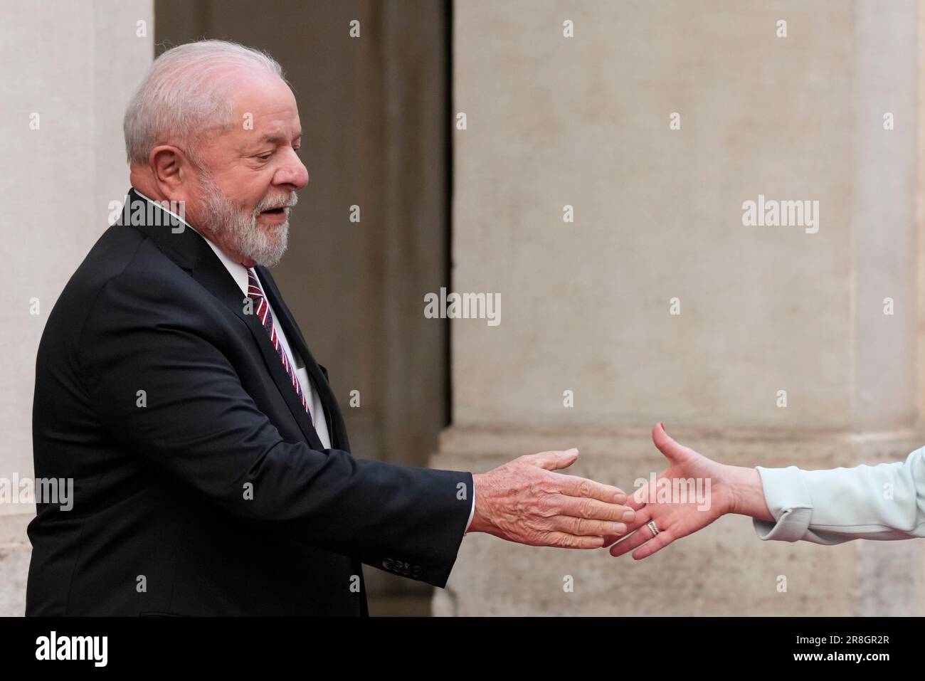 Brazilian President Luiz Inácio Lula da Silva is welcomed by Italian ...
