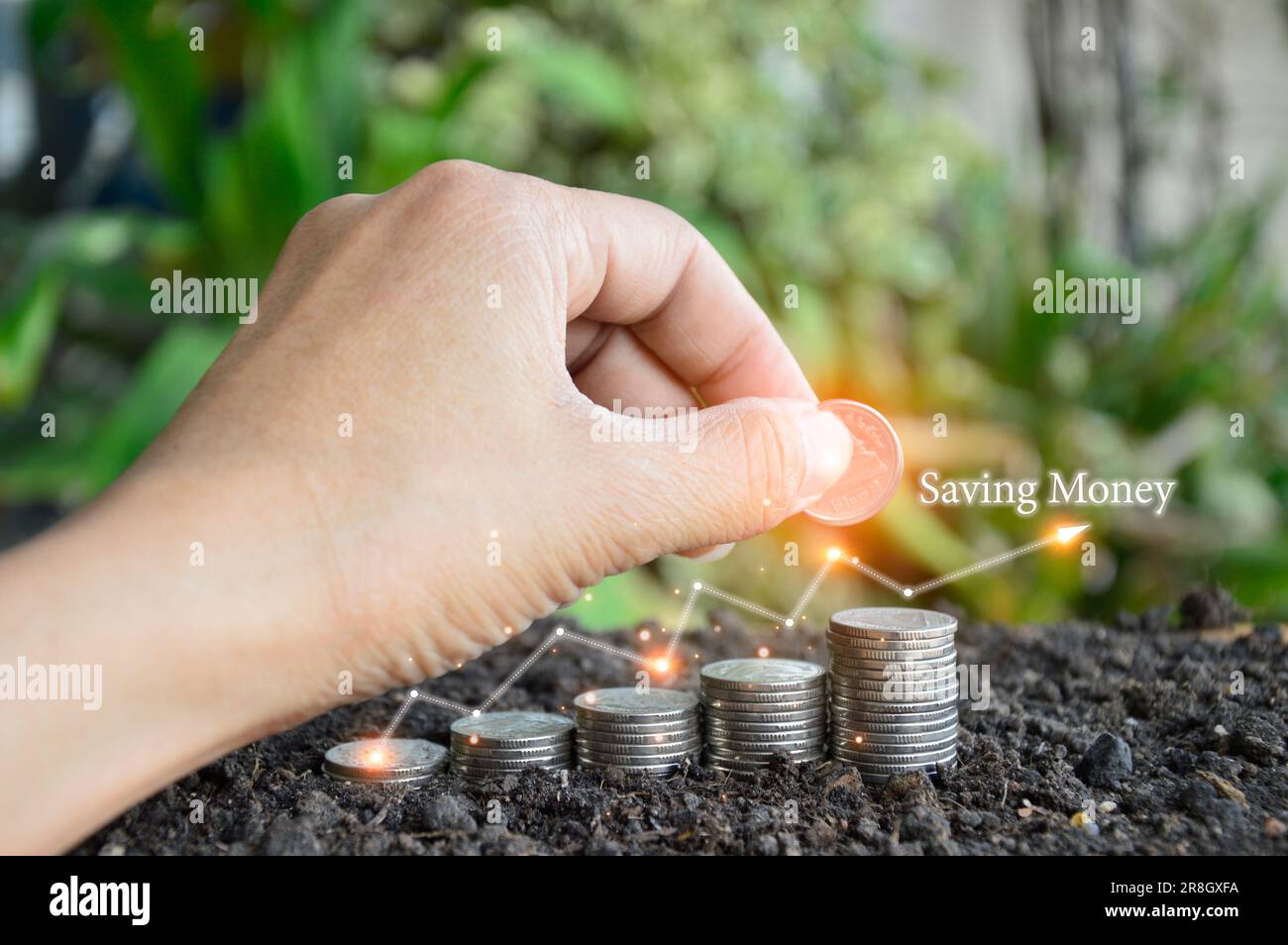 Businessman holding stacks of coins Money Savings Concepts for ...