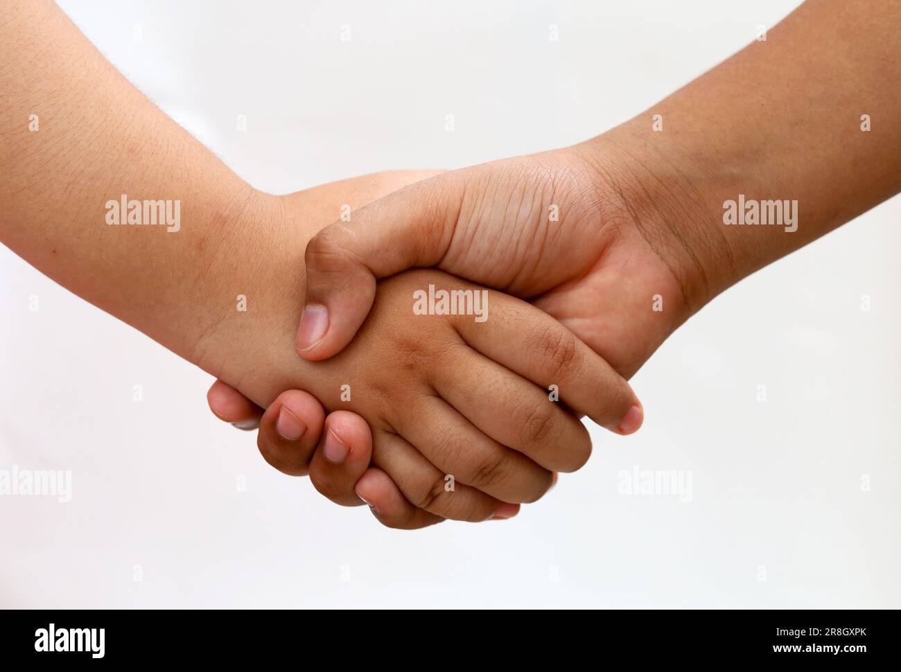 Kids handshake isolated on white background. cooperation concept image ...