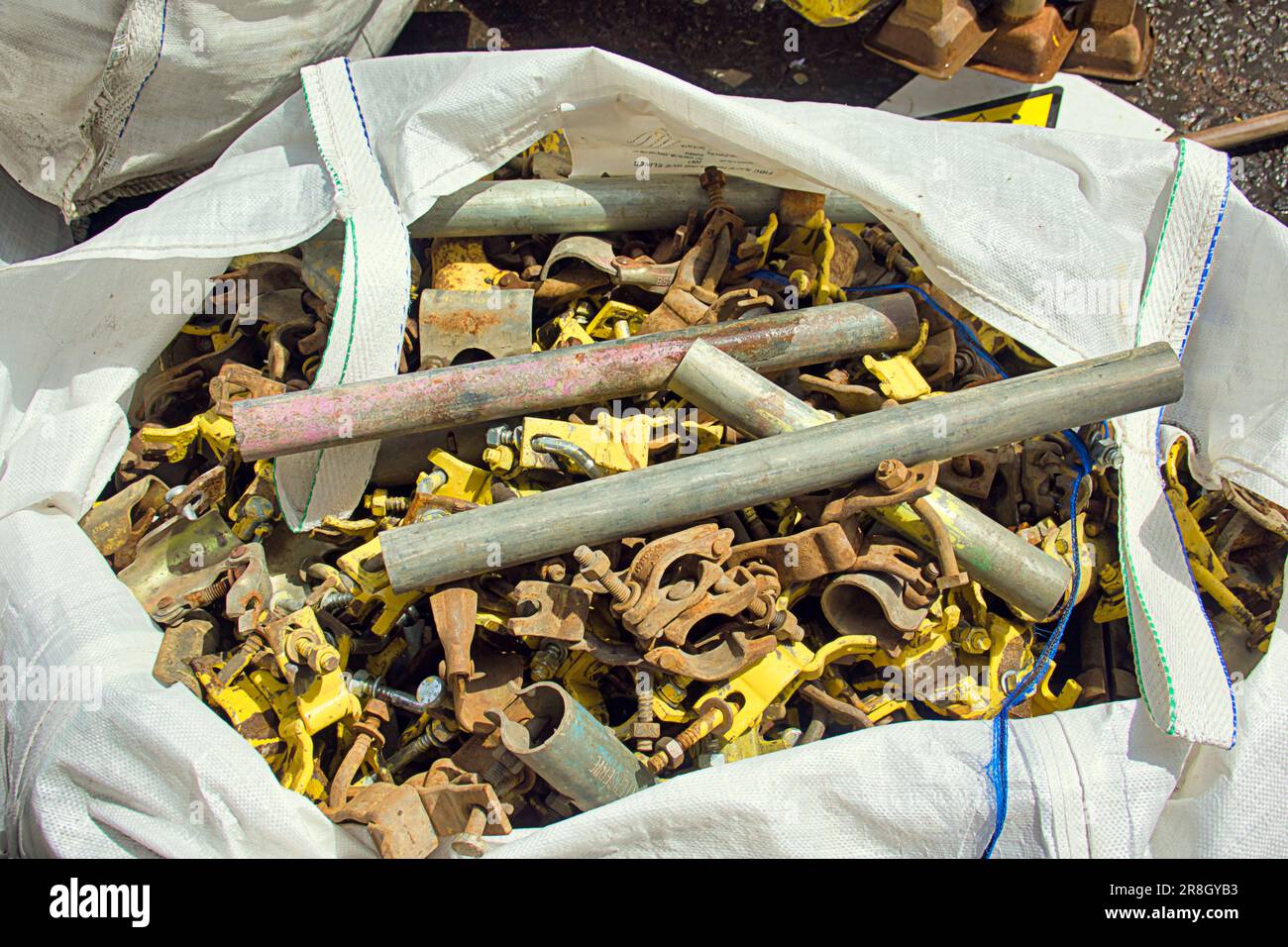 bags of scrap metal iron scaffolding parts Stock Photo - Alamy