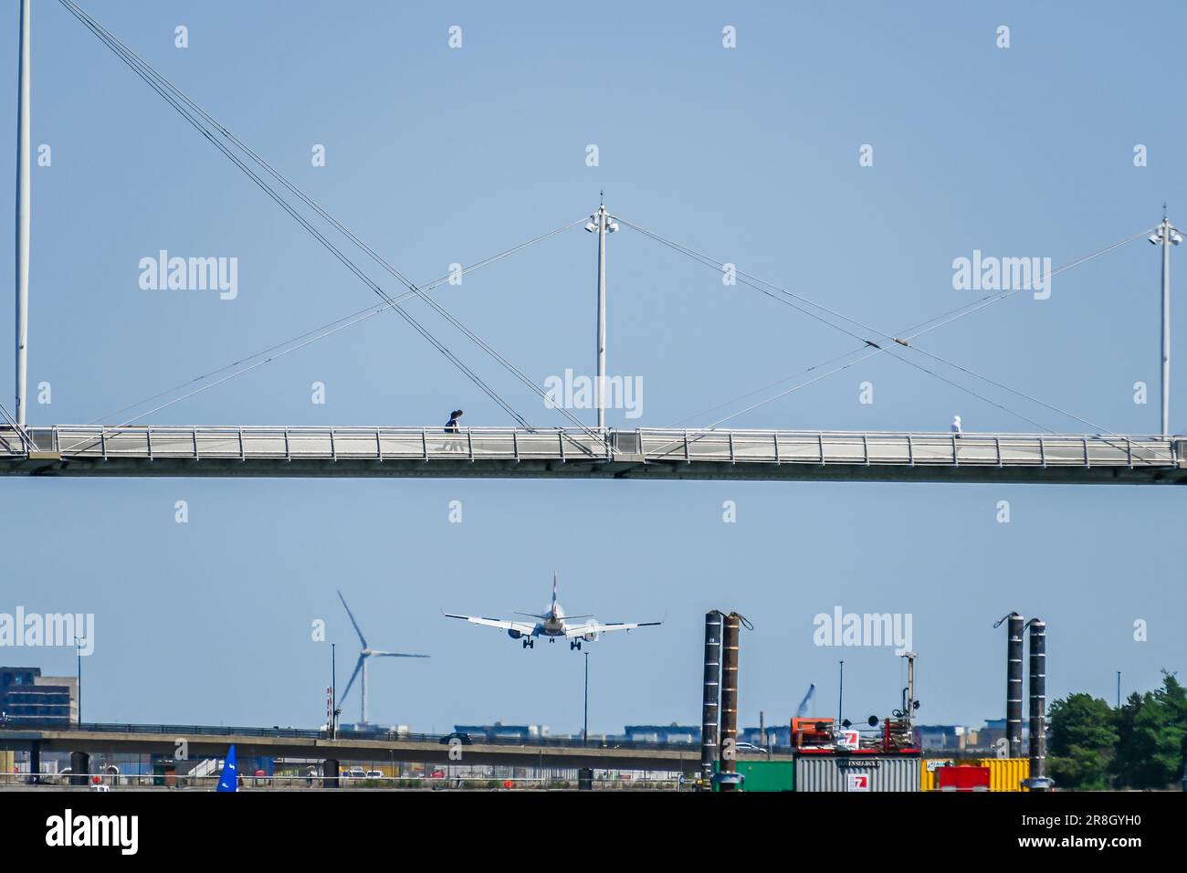Royal Victoria Dock Footbridge as airplane landing at City Airport ...