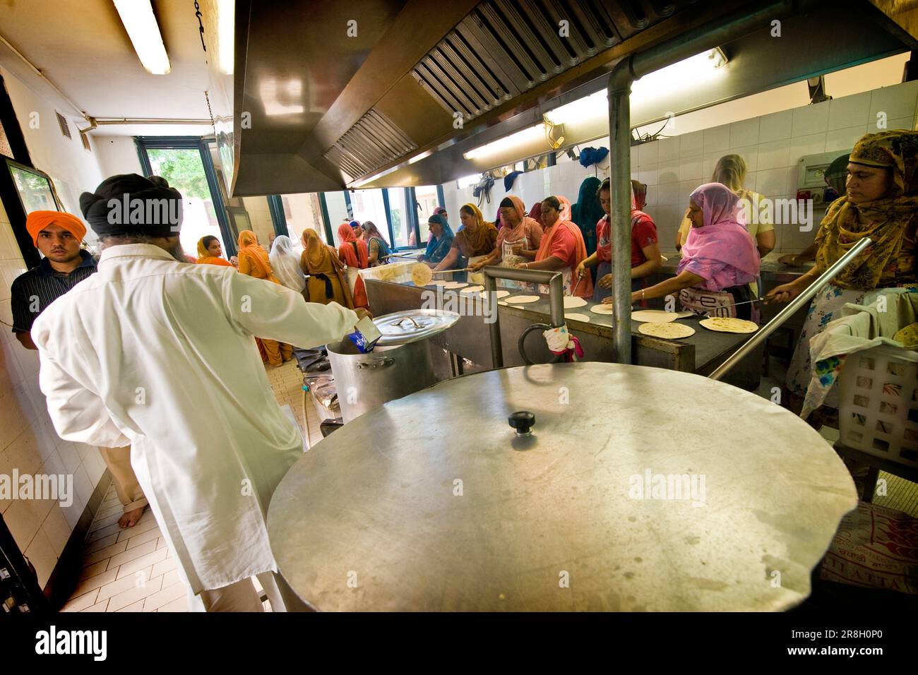 Women who cook chapati. Sikh community. Sikhdharma Gurdwara Singh Sabha ...
