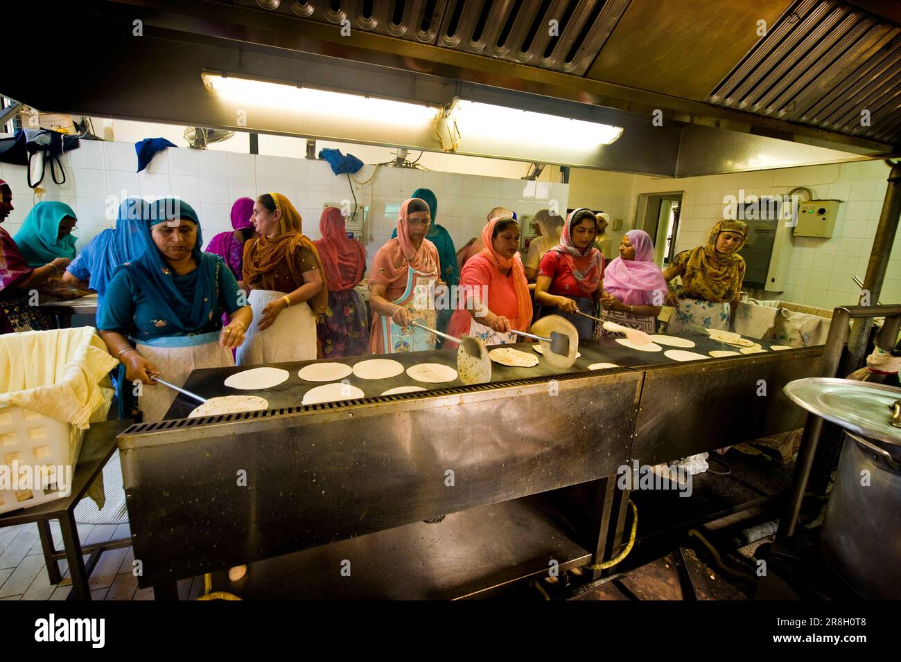 Women who cook chapati. Sikh community. Sikhdharma Gurdwara Singh Sabha ...