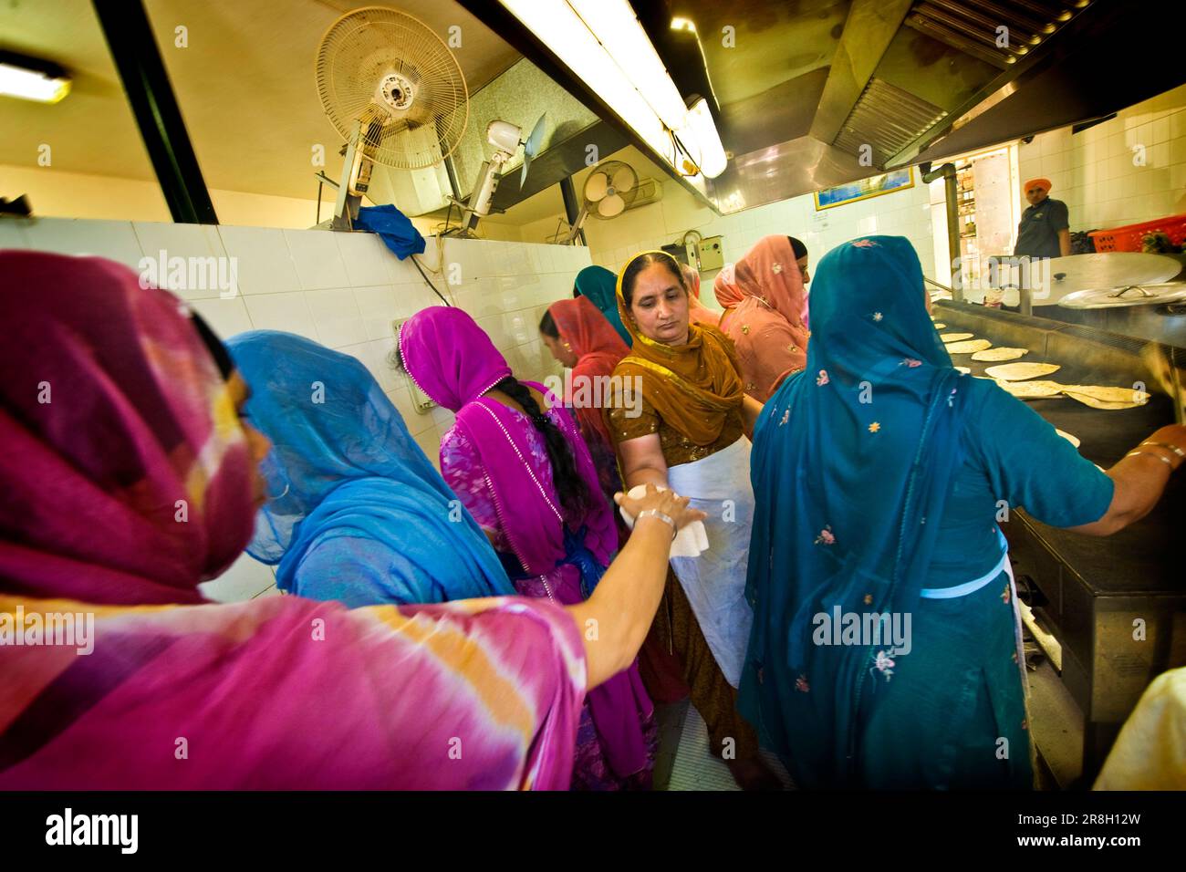 Women who cook chapati. Sikh community. Sikhdharma Gurdwara Singh Sabha ...