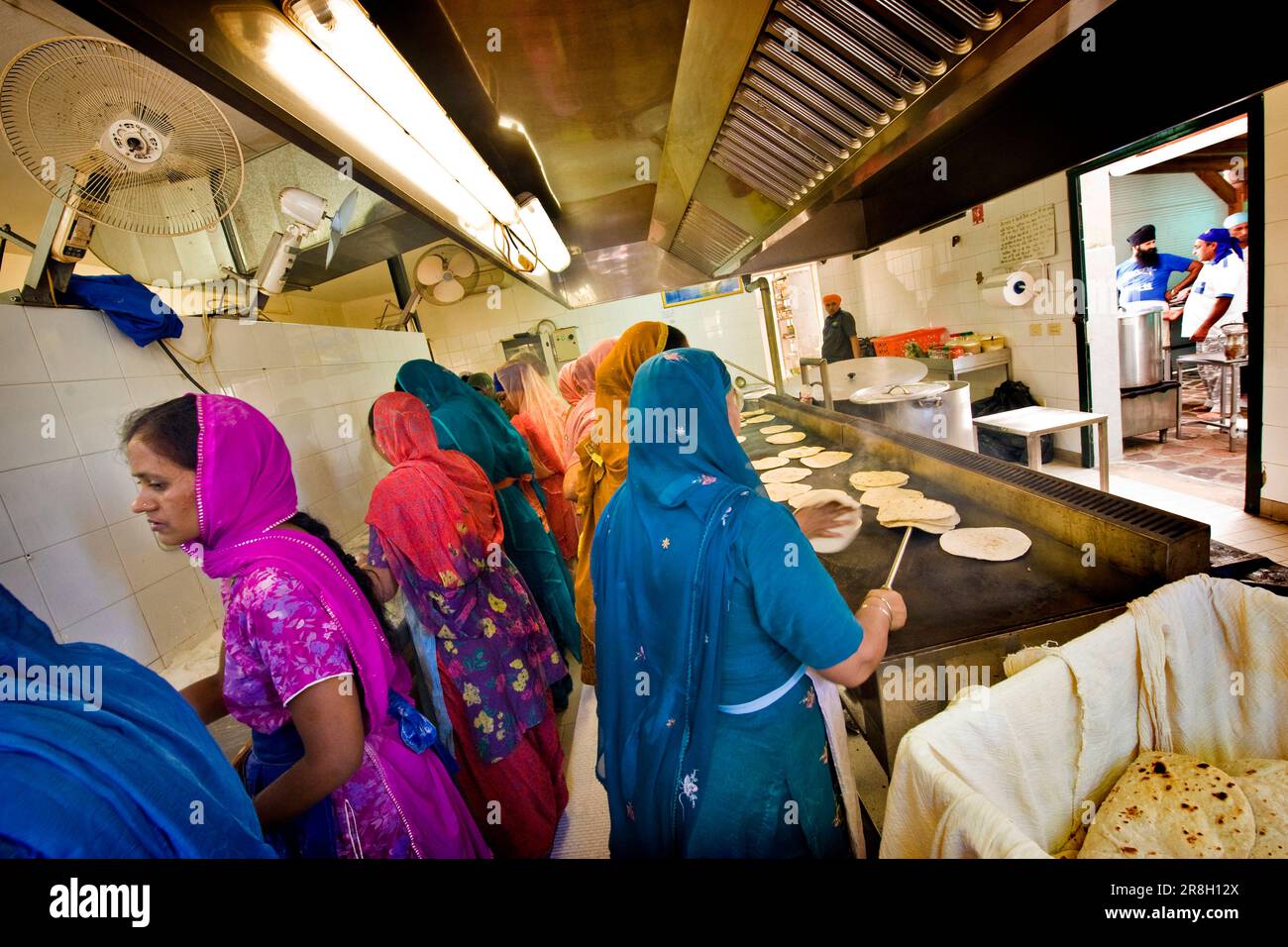 Women who cook chapati. Sikh community. Sikhdharma Gurdwara Singh Sabha ...