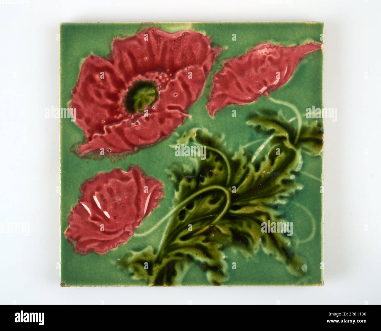 Antique 1900s Corn Bros Art Nouveau pink poppy pottery tile Stock Photo ...