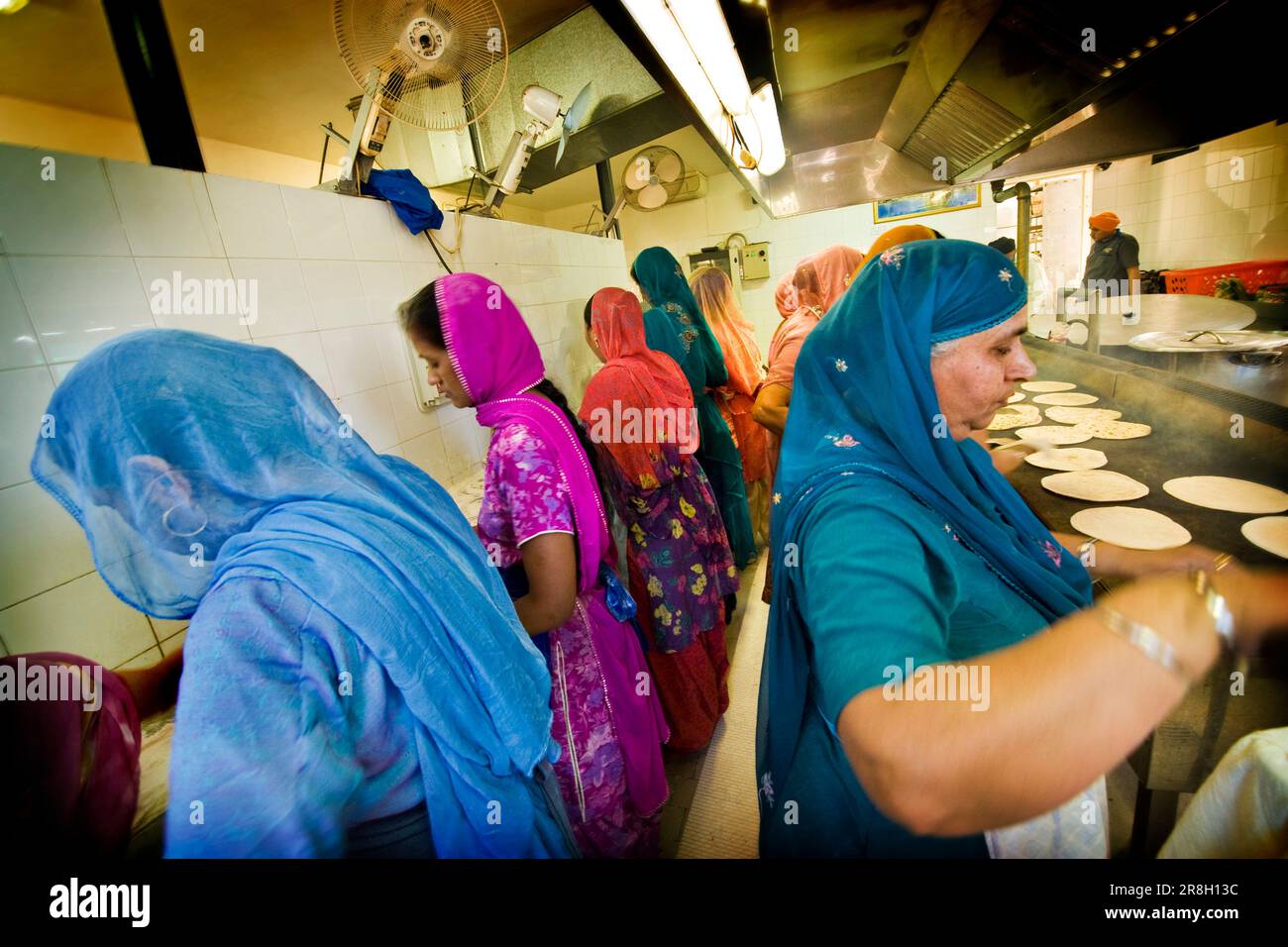 Women who cook chapati. Sikh community. Sikhdharma Gurdwara Singh Sabha ...