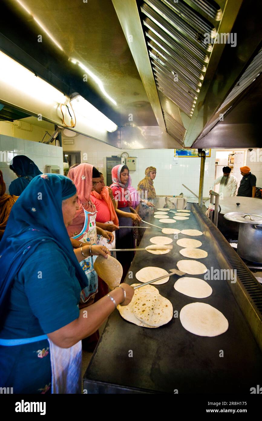 Women who cook chapati. Sikh community. Sikhdharma Gurdwara Singh Sabha ...