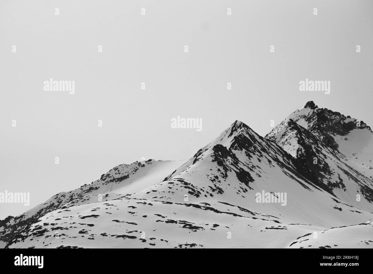 Snow and mountains with featureless sky in monochrome Stock Photo - Alamy