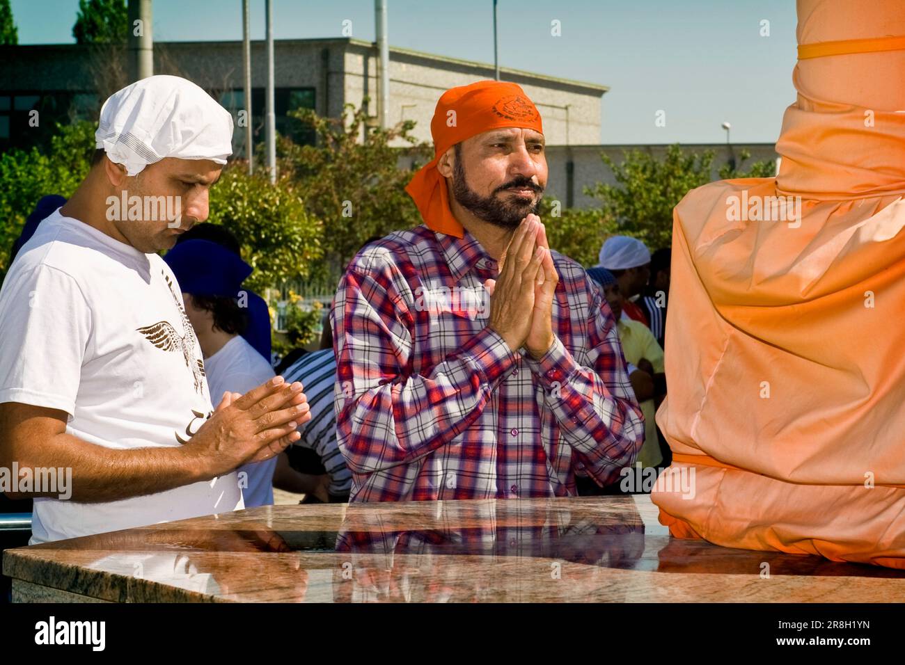 Adoration of the Gurdwara flag. Sikh community. Sikhdharma Gurdwara ...