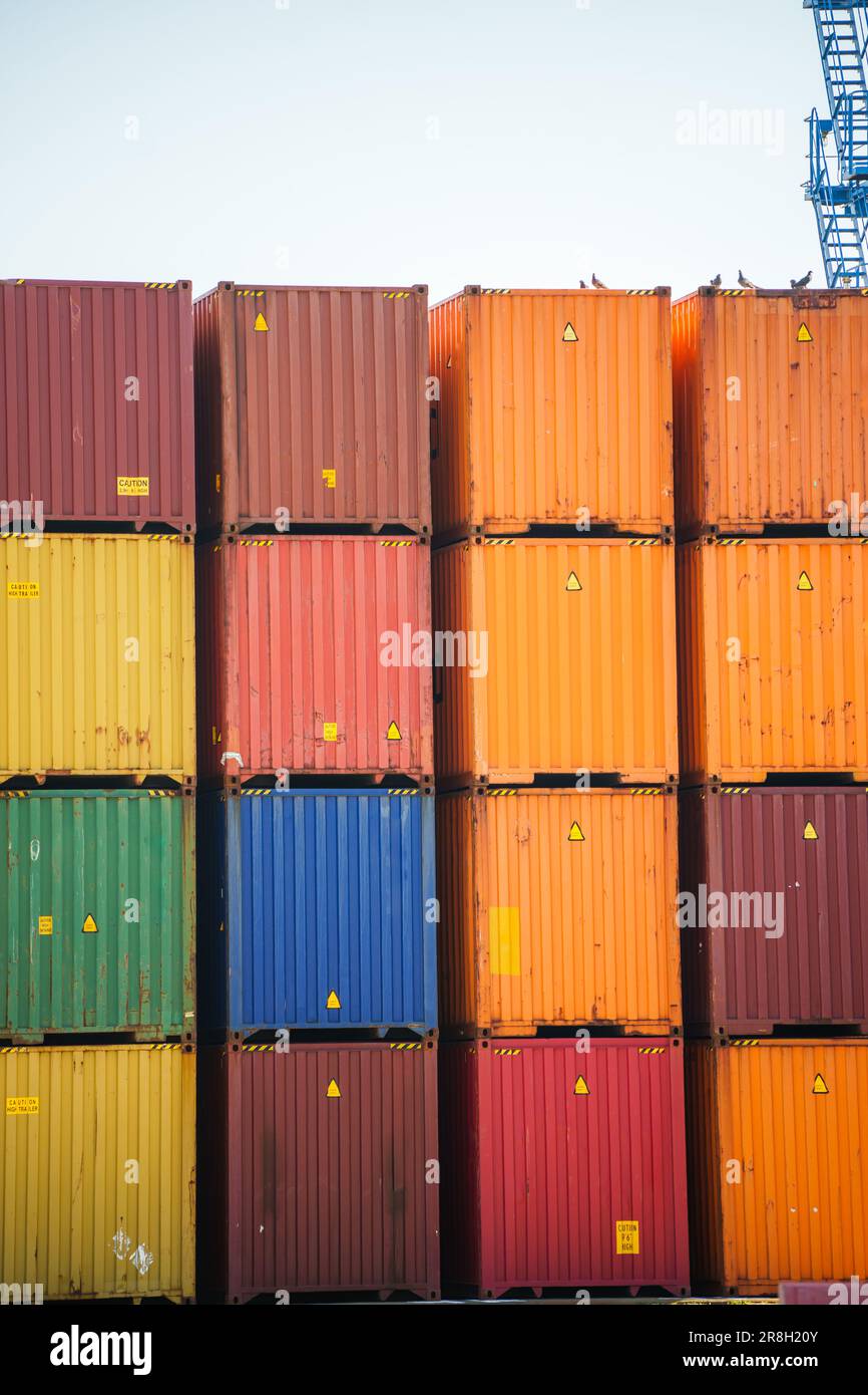 Shipping containers stacked at a commercial port Stock Photo - Alamy