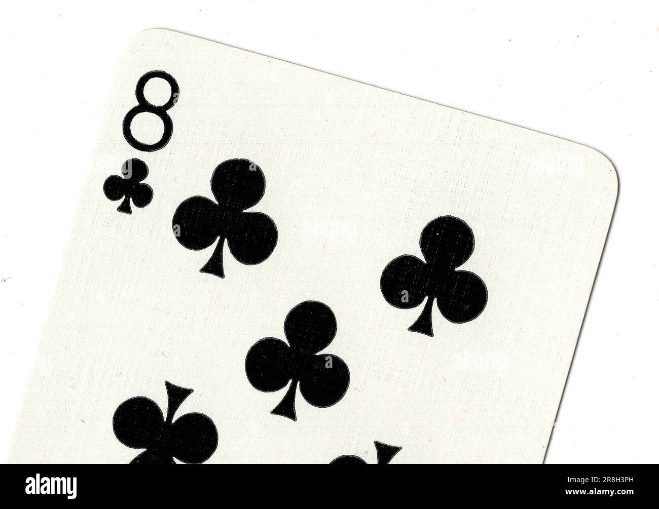 An eight of clubs vintage playing card on a white background Stock ...