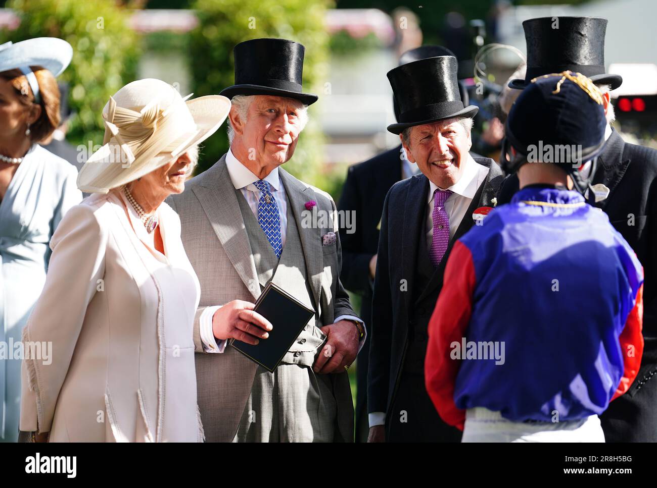 Queen Camilla, King Charles III and John Warren in the parade ring ...