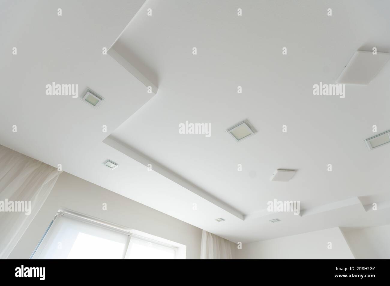 Classic white glossy ceiling with recessed spotlights Stock Photo - Alamy