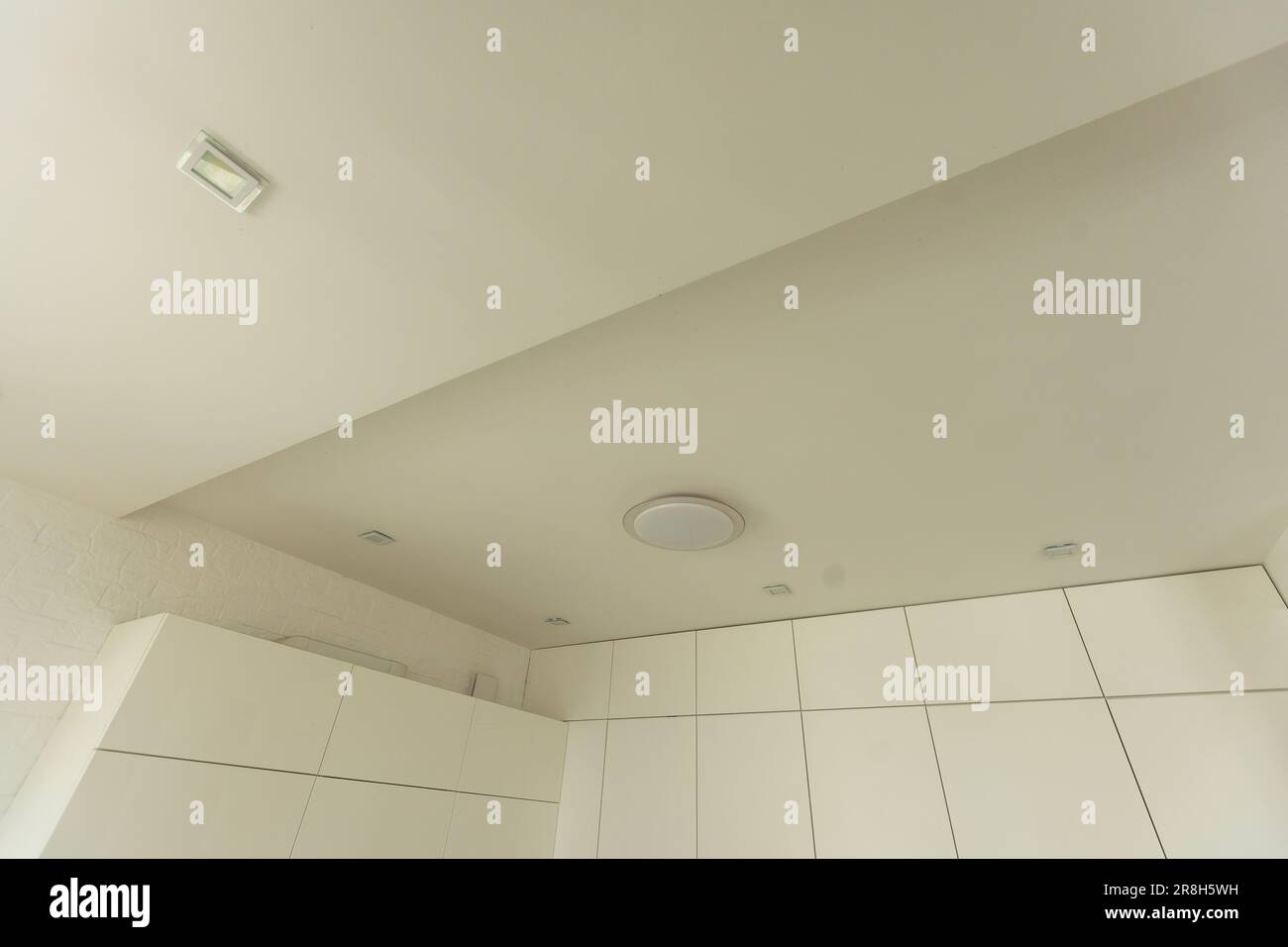 Clean gypsum board ceiling in construction site. Under construction a ...