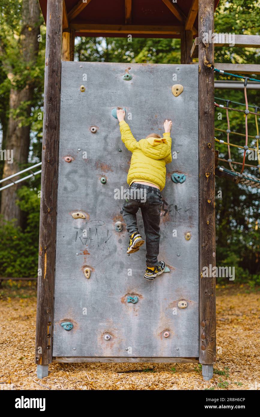 Boy At The Climbing Wall Without A Helmet, Danger At The Climbing Wall ...