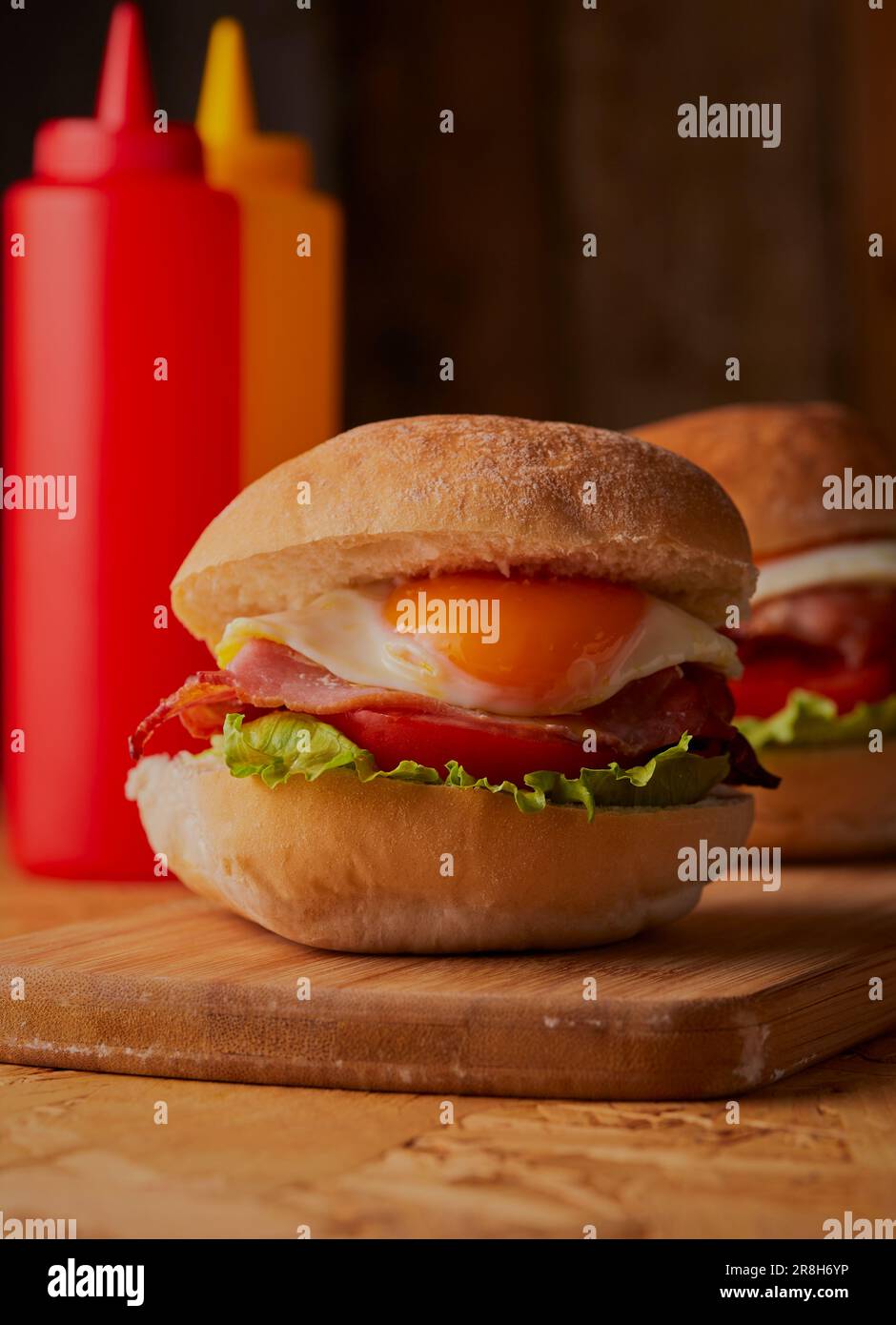 Bacon,Fried egg,lettuce and tomato bun in a fast food restaurant Stock ...