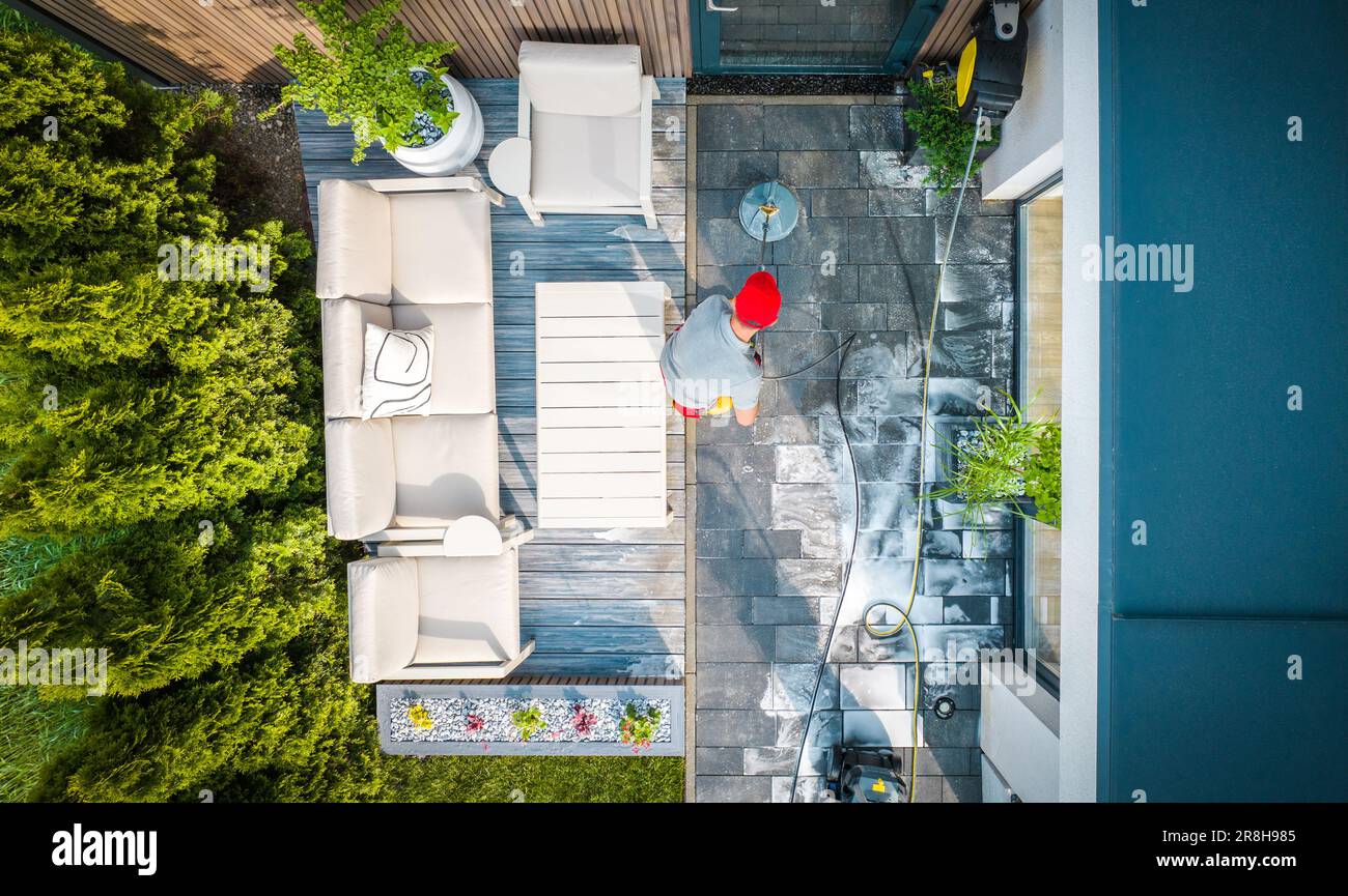 Top View of Caucasian Home Owner Washing the Walkway at His Small ...