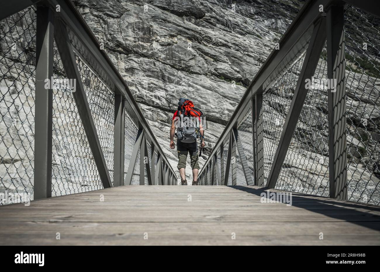 Hiker Crossing Mountain Trail Bridge on the Way Down From Glacier Head ...