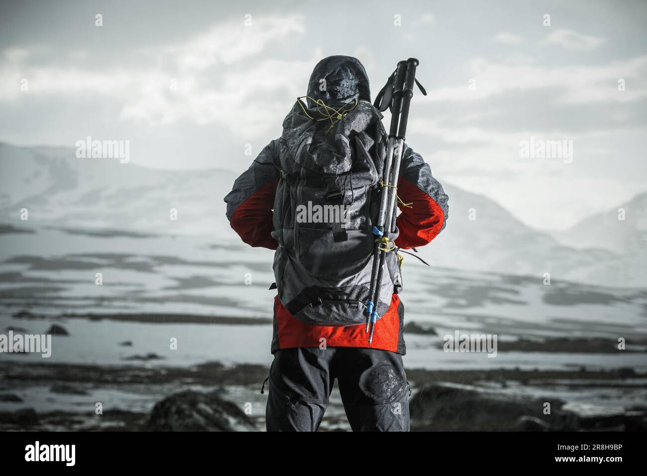 Cold and Rainy Weather on a Hike. Men with Backpack and Trekking Poles ...